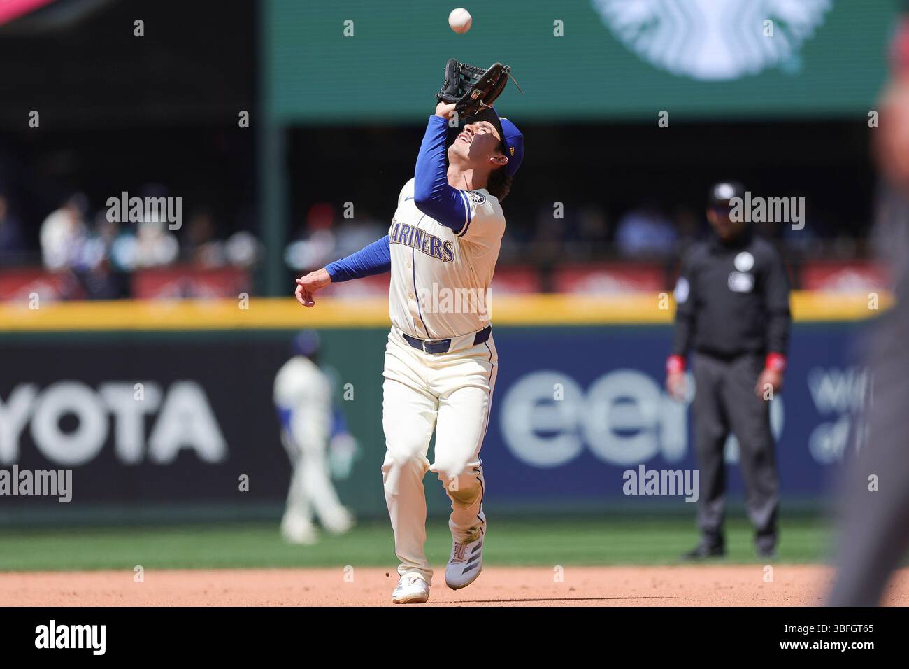 Seattle Mariners shortstop Cole Young catches a popout by Minnesota ...