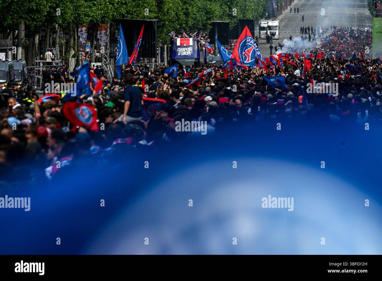 Thousands of people gathered on the Champs-Elysees in Paris to watch ...
