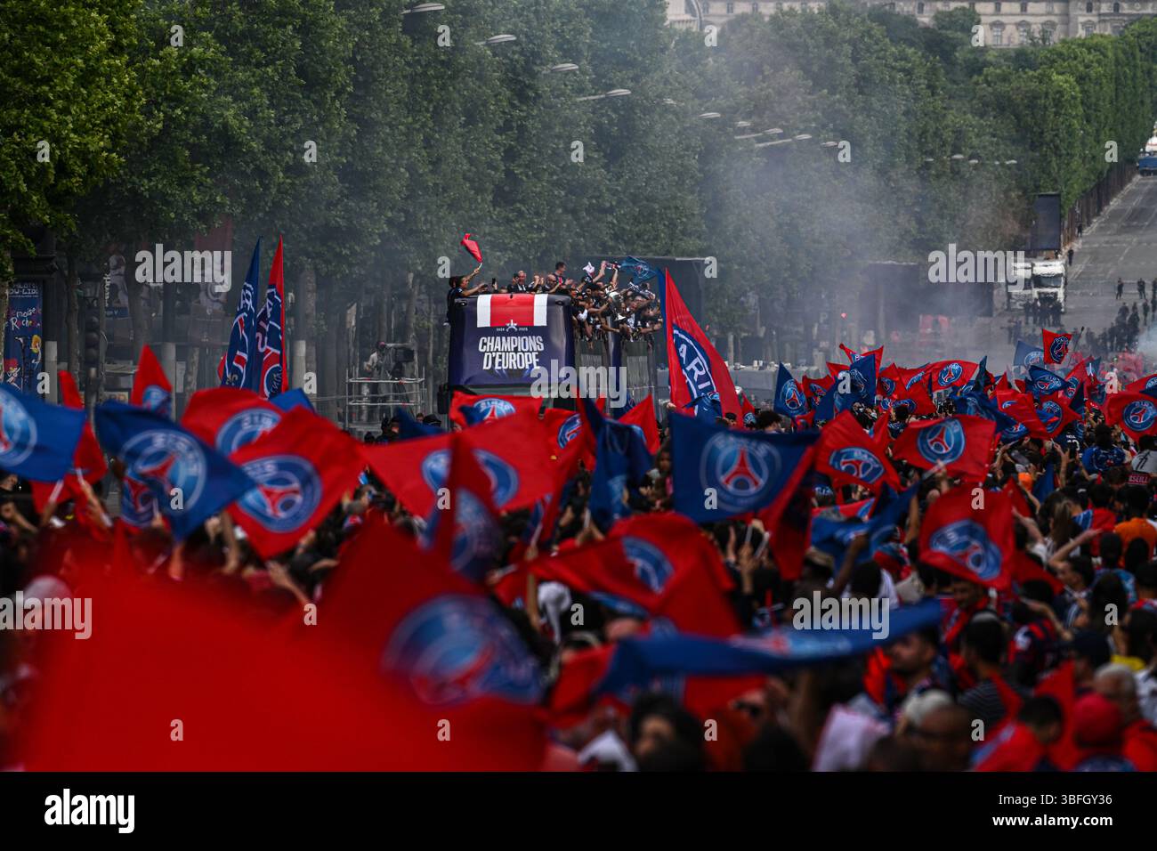 Thousands of people gathered on the Champs-Elysees in Paris to watch ...