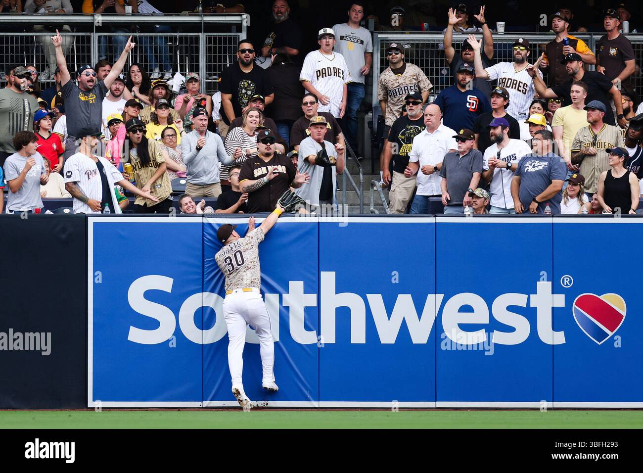 San Diego Padres left fielder Gavin Sheets (30) attempts to catch a fly ...