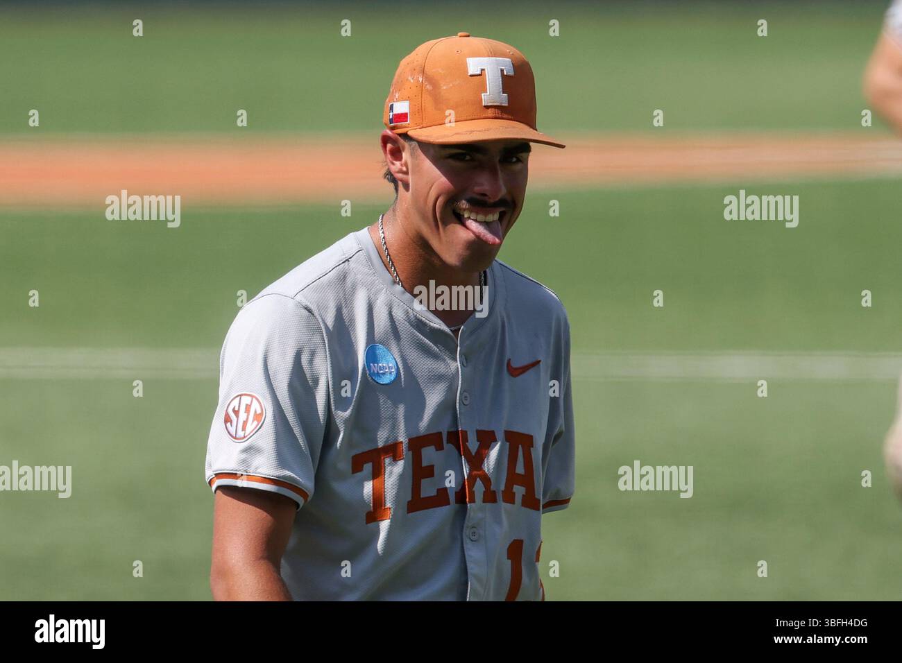 AUSTIN, TX - JUNE 01: Texas pitcher Ruger Riojas (13) sticks his tongue ...