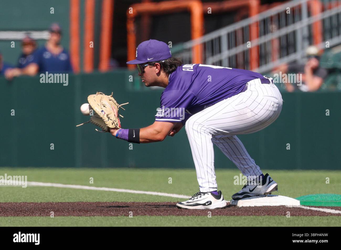 AUSTIN, TX - JUNE 01: Kansas St. infielder Sam Flores (4) squats down ...