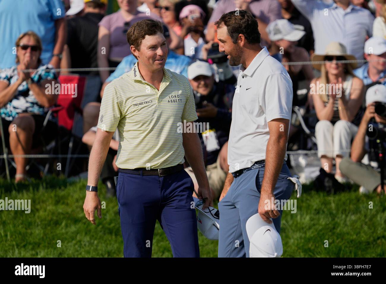 Ben Griffin, left, talks with Scottie Scheffler, right, on the 18th ...