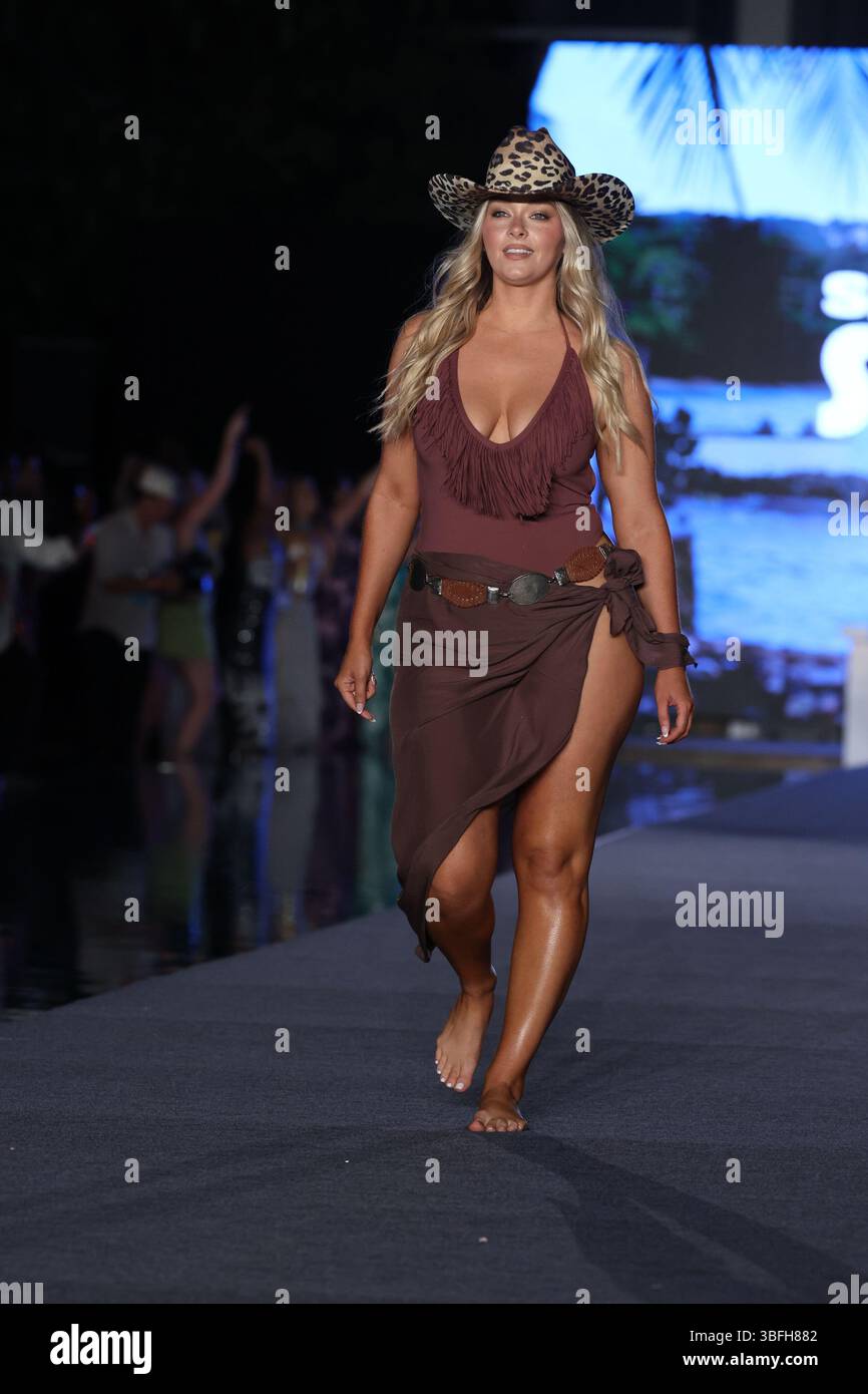 MIAMI BEACH, FLORIDA - MAY 31: Camille Kostek walks the runway at the ...