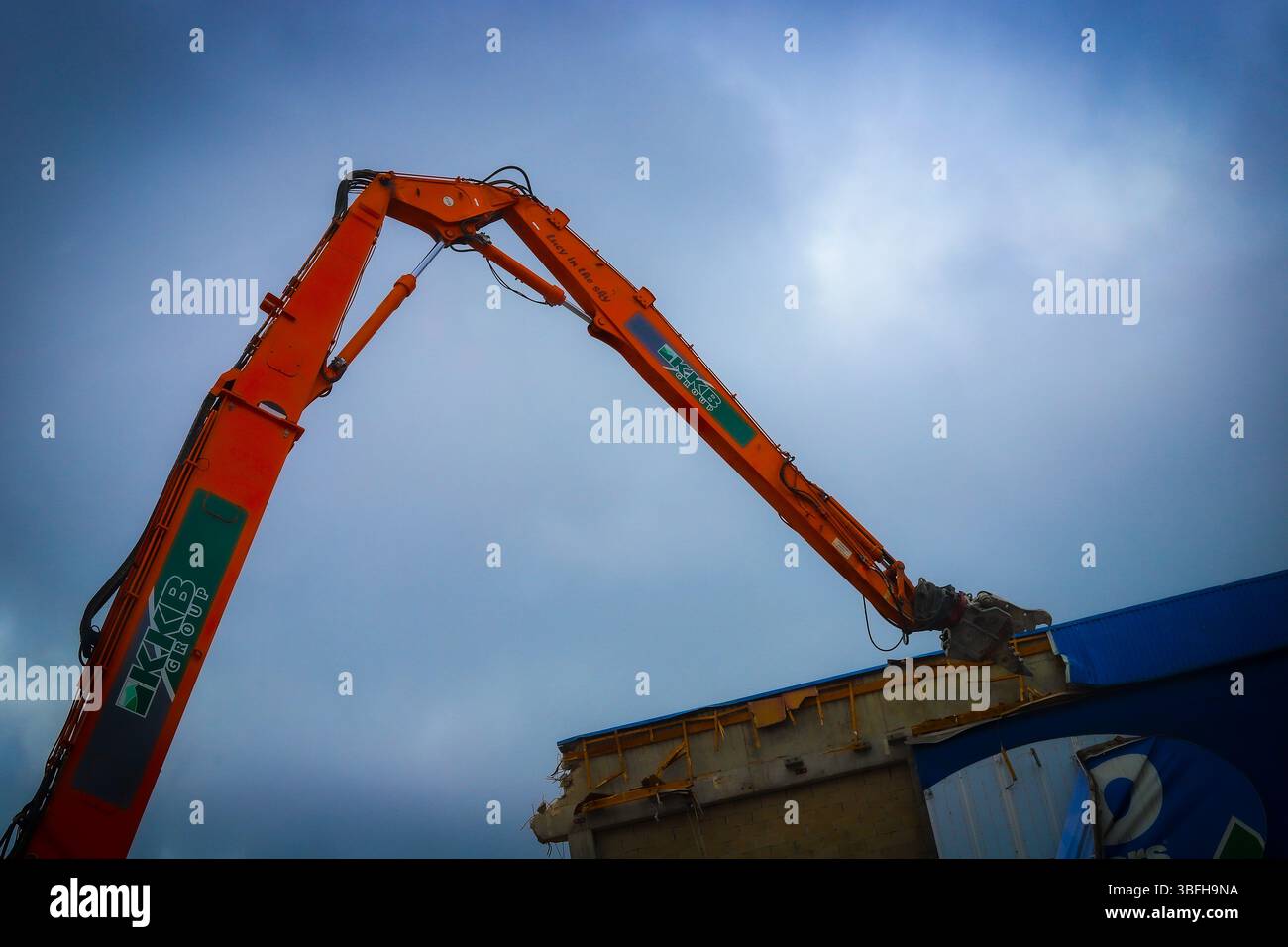Demolition claw dismantling a large former retail unit in central ...