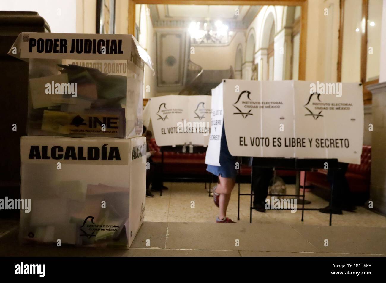 A Mexican citizen voting at polling station during the Judicial Branch ...