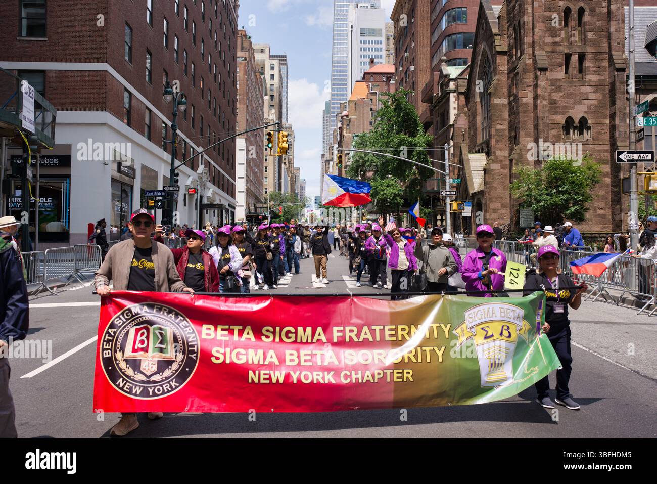 A New York City street scene featuring a parade of Beta Sigma ...