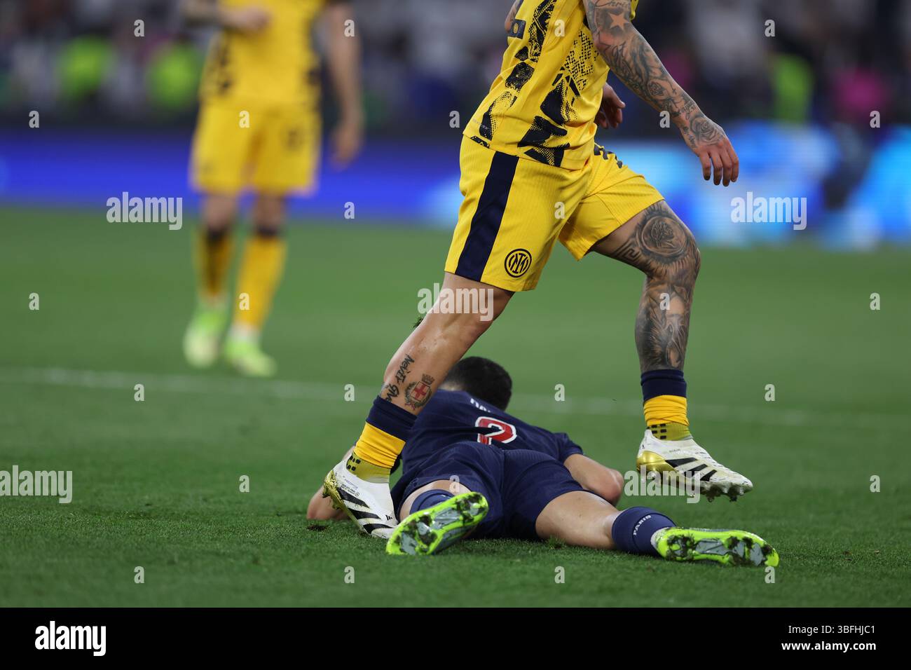 Munich, Germany. 31st May, 2025. Achraf Hakimi of PSG falls to the ...