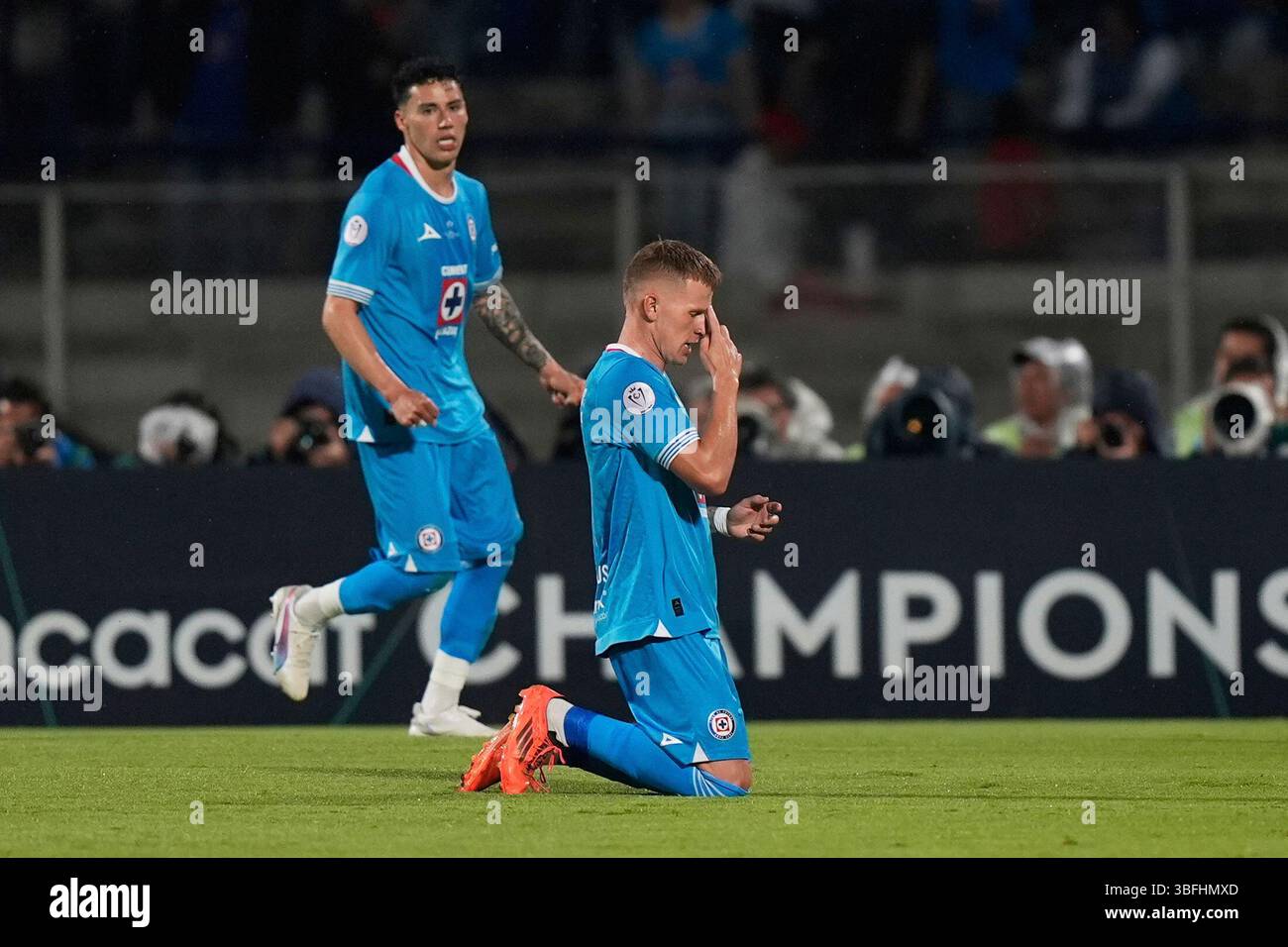 Mateusz Bogusz of Mexico's Cruz Azul, center, celebrates scoring his ...