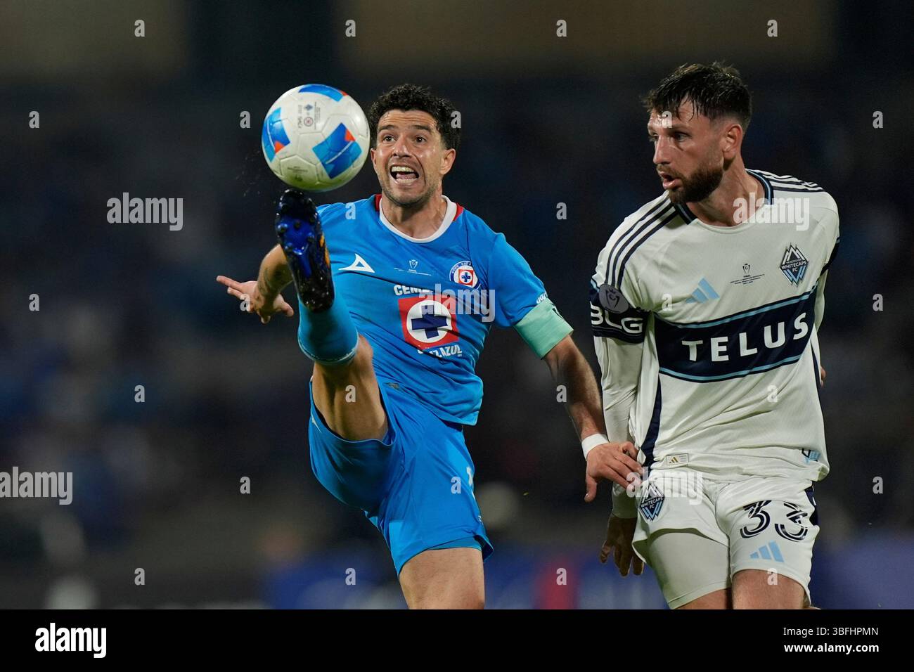 Ignacio Rivero of Mexico's Cruz Azul, left, controls the ball ...