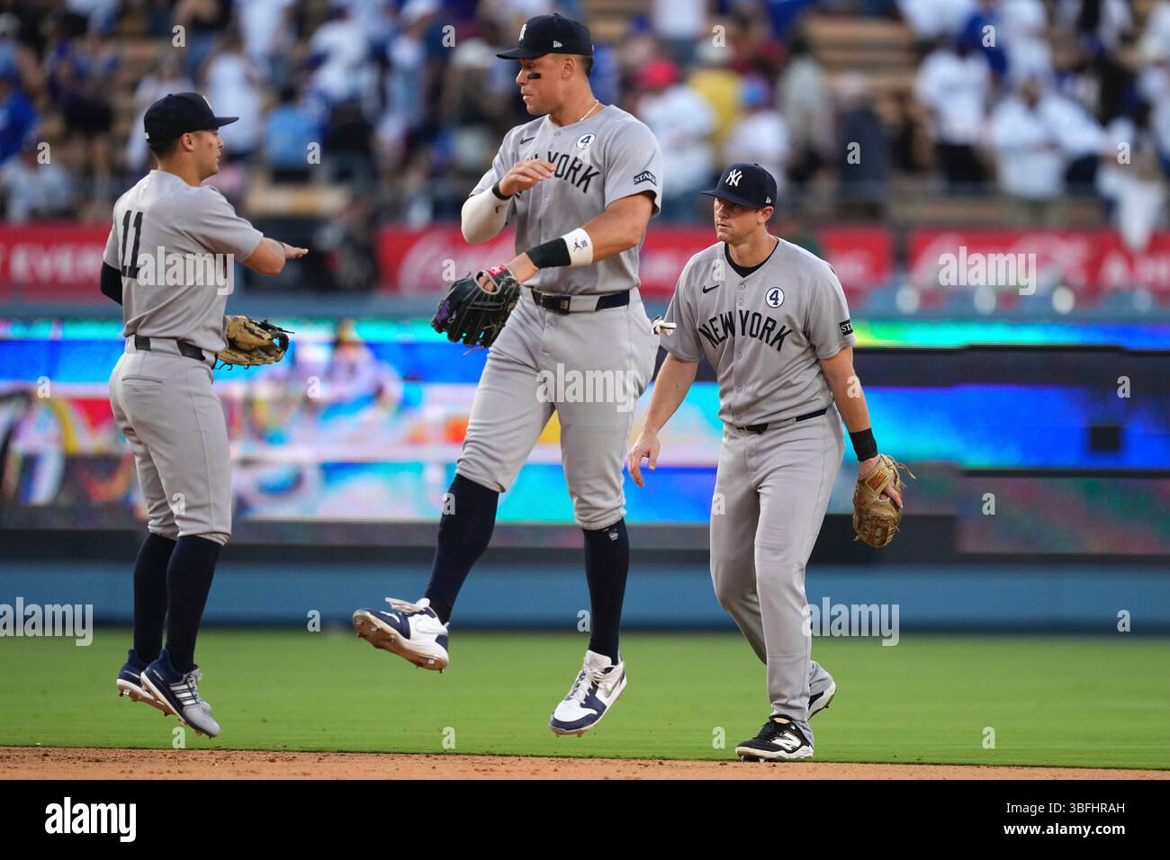 New York Yankees' Aaron Judge, center, celebrates with Anthony Volpe ...