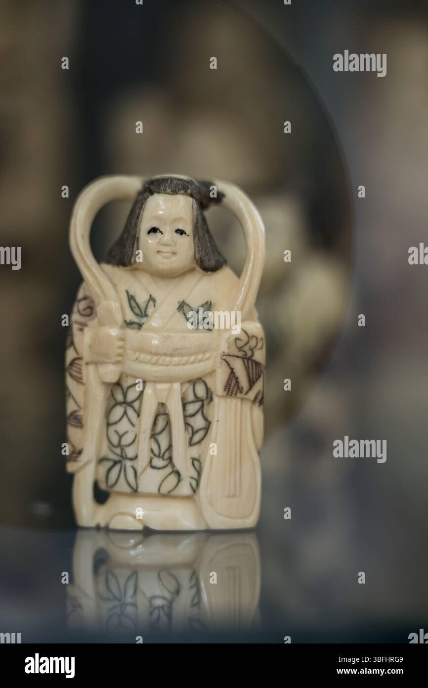 A rare circa 1890 (Meiji Period) hand-carved bone netsuke sculpture of ...