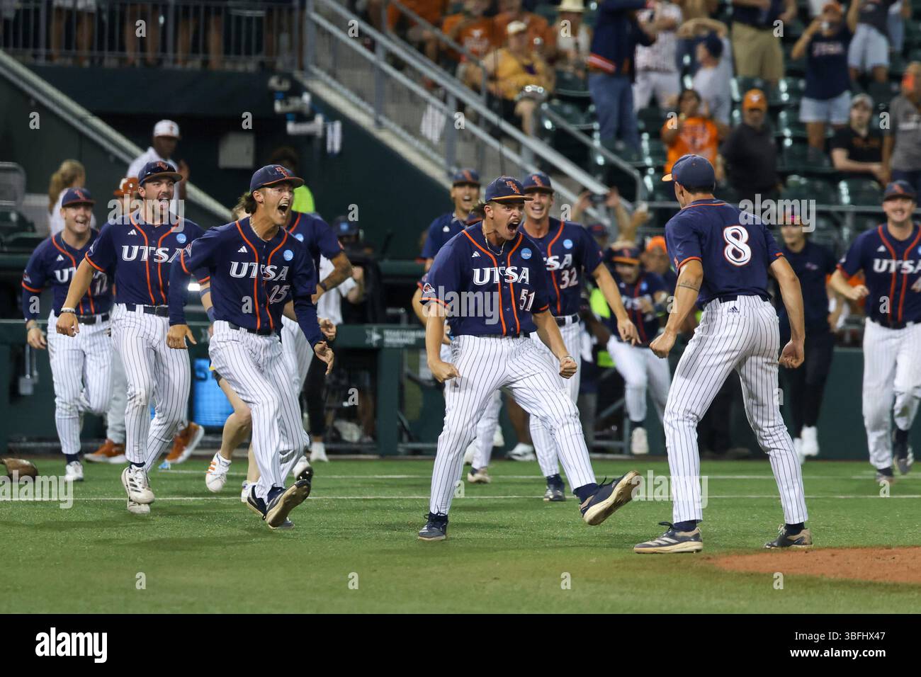 AUSTIN, TX - JUNE 01: UTSA players rush the field to celebrate winning ...