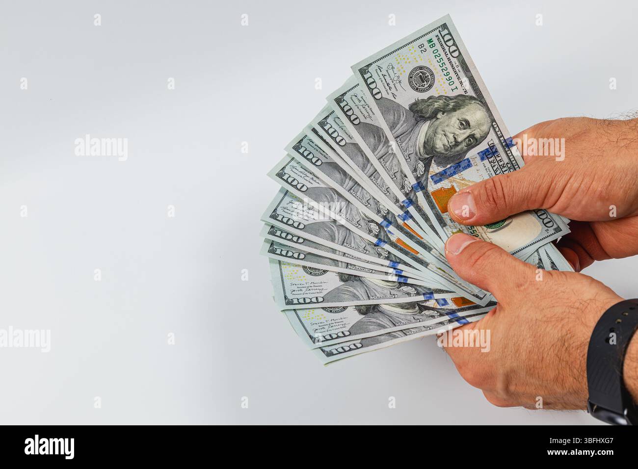 Hands display fan hundred dollar hi-res stock photography and images ...