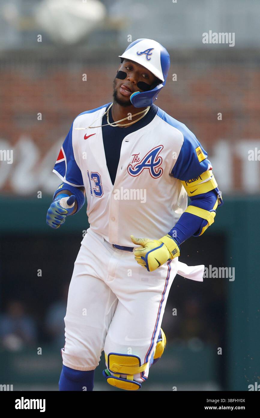 Atlanta Braves' Ronald Acuña Jr. celebrates as he rounds the bases ...