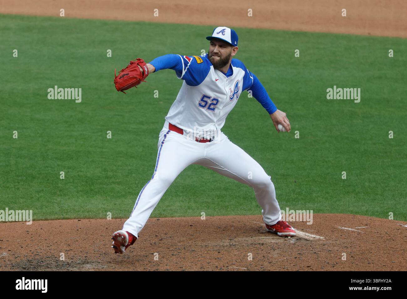 Atlanta Braves pitcher Dylan Lee throws during the eighth inning of a ...