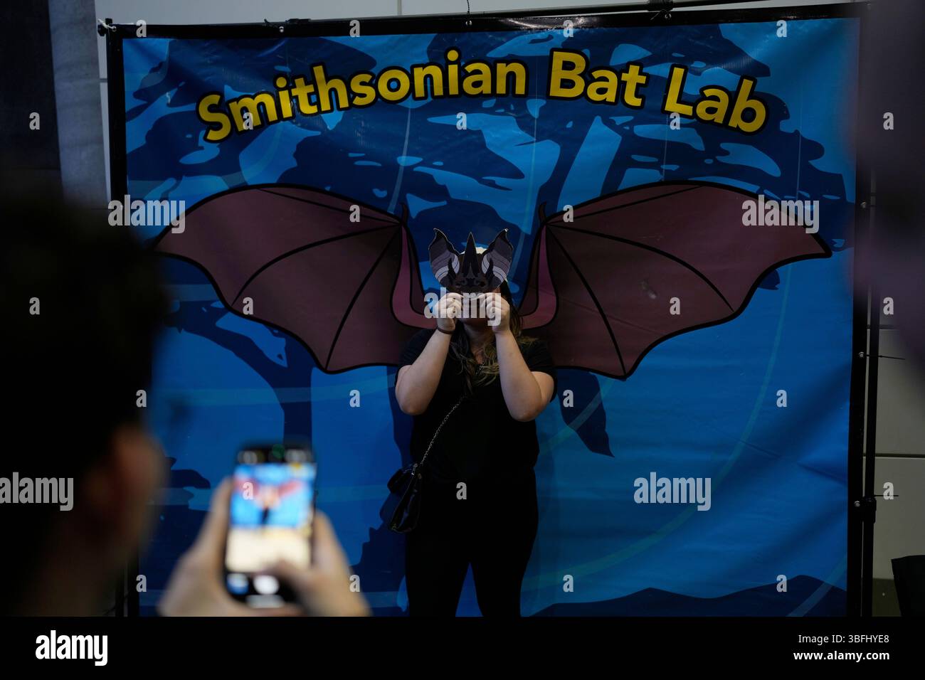 A visitor poses for a photo at the Smithsonian Tropical Research ...