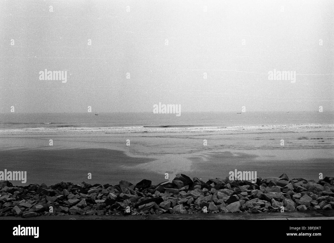 Early-2010s China Rocky Shore Seascape at Low Tide under Hazy Sky Stock ...