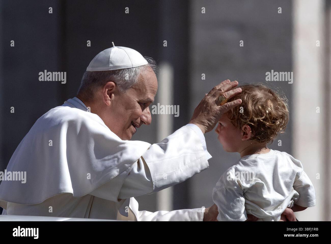 Vatican City, Vatican. 01st June, 2025. Pope Leo XIV greets a child upon his arrival in his ...