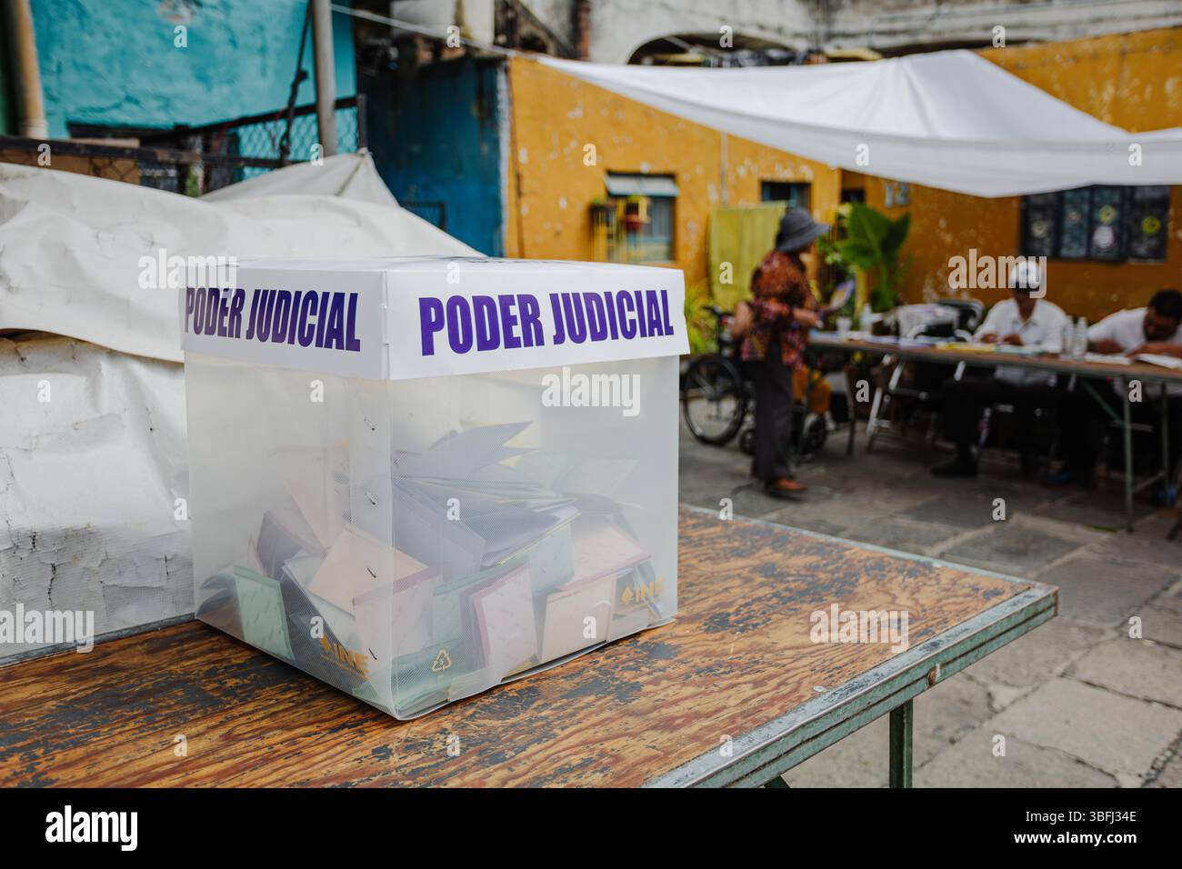 A transparent ballot box labeled “Poder Judicial” is displayed at a ...