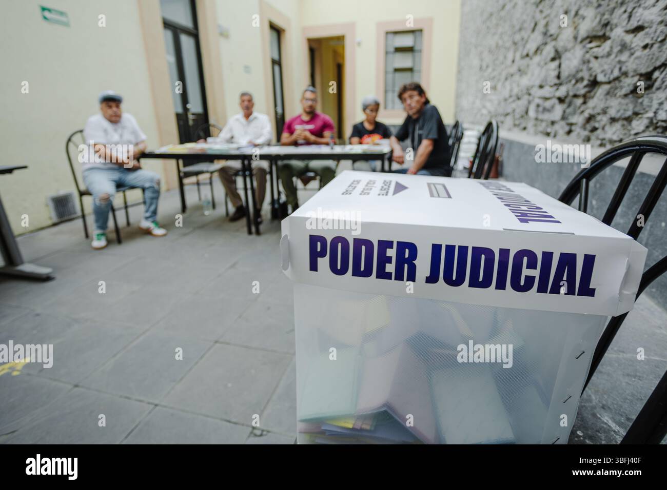 A transparent ballot box labeled “Poder Judicial” is displayed at a ...