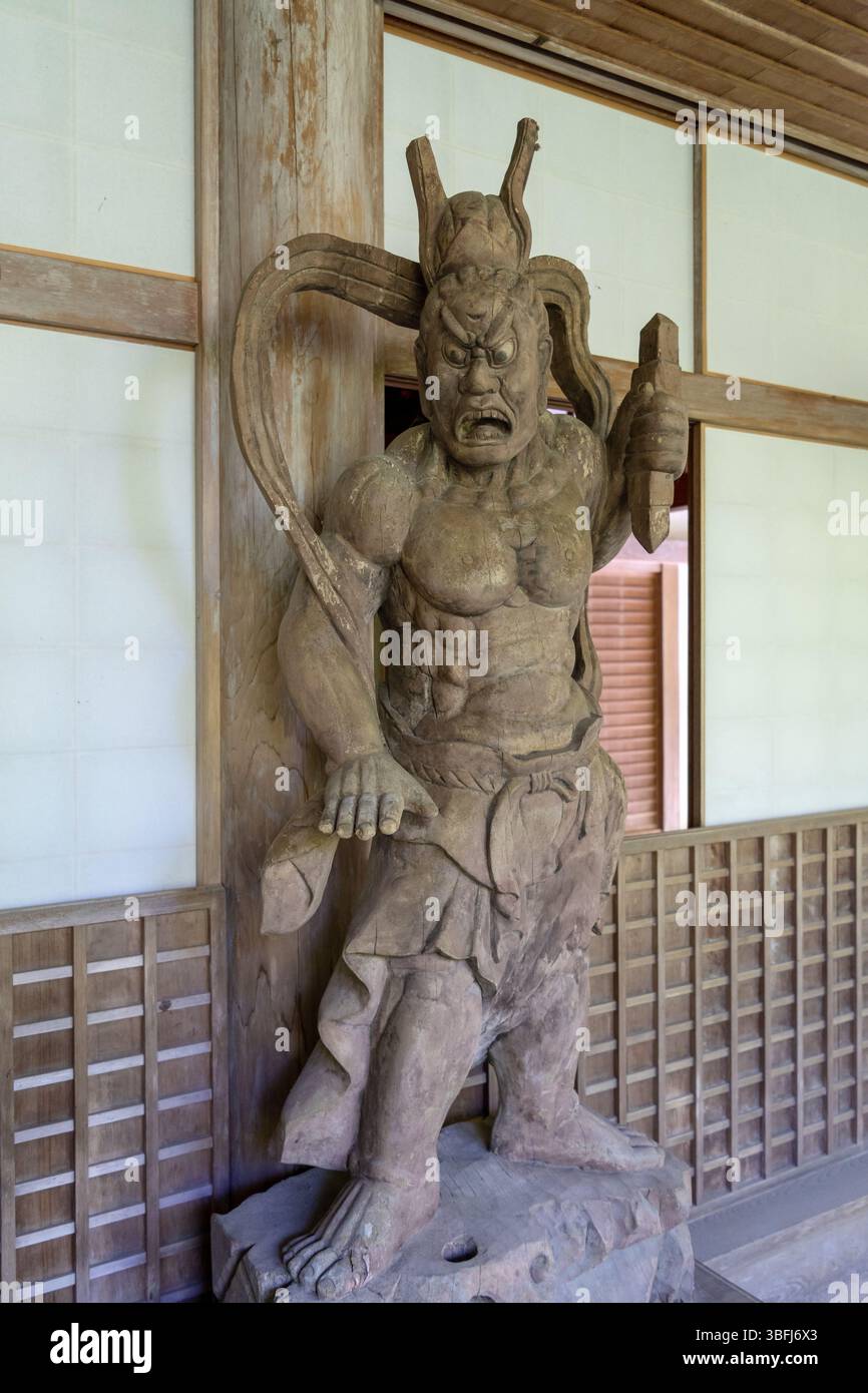 Wooden statue of fierce Nio guardian, known as Kongorikishi, protecting ...