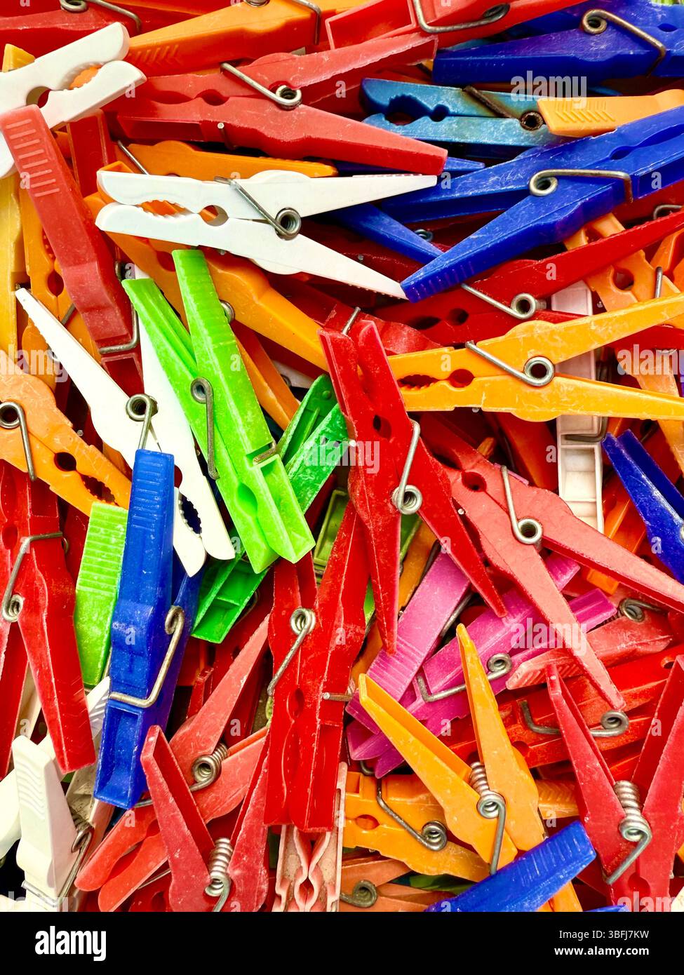 Multi-coloured clothes pegs Stock Photo - Alamy