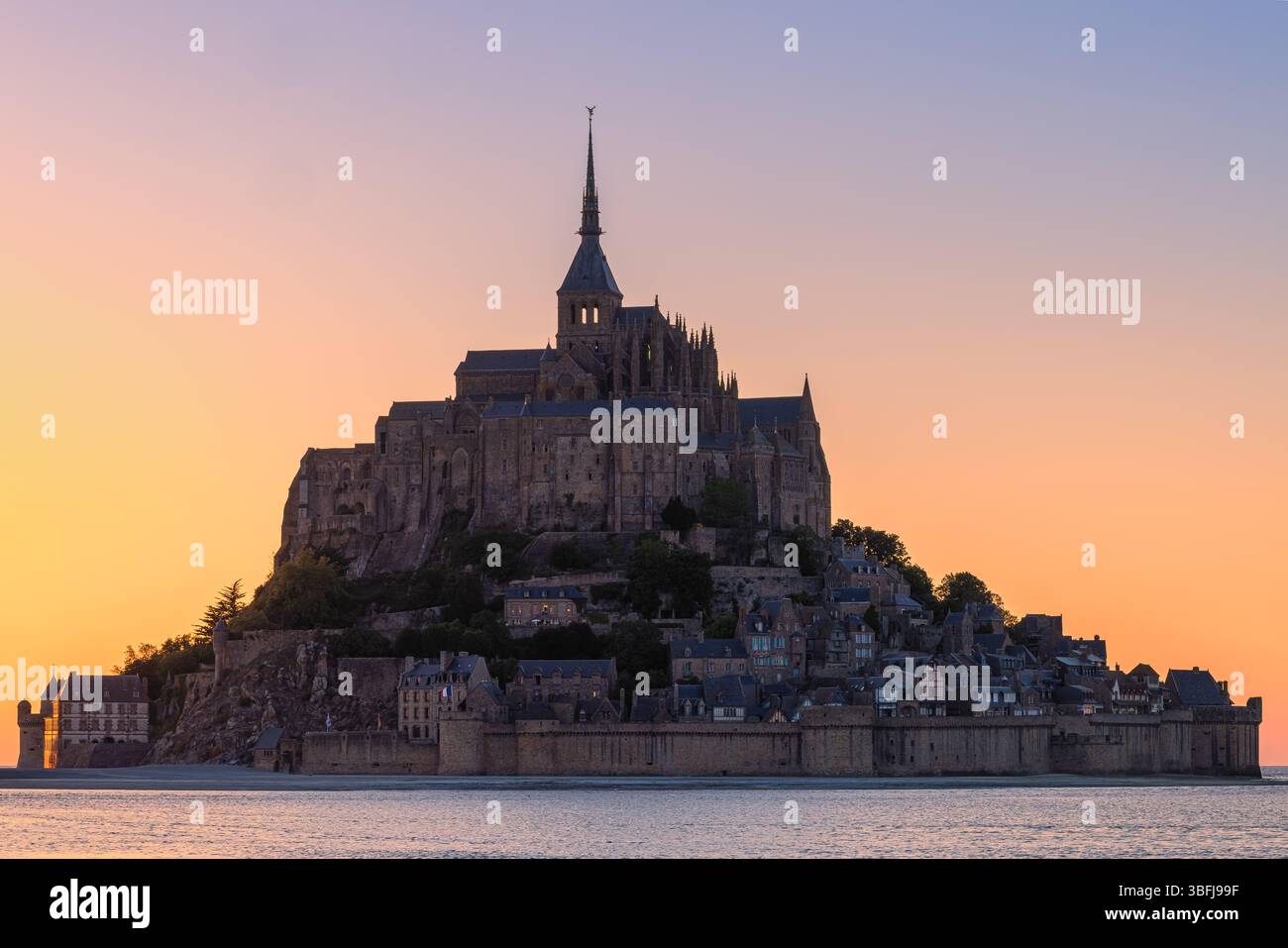 The famous Mont Saint-Michel during sunset, standing on the west coast ...