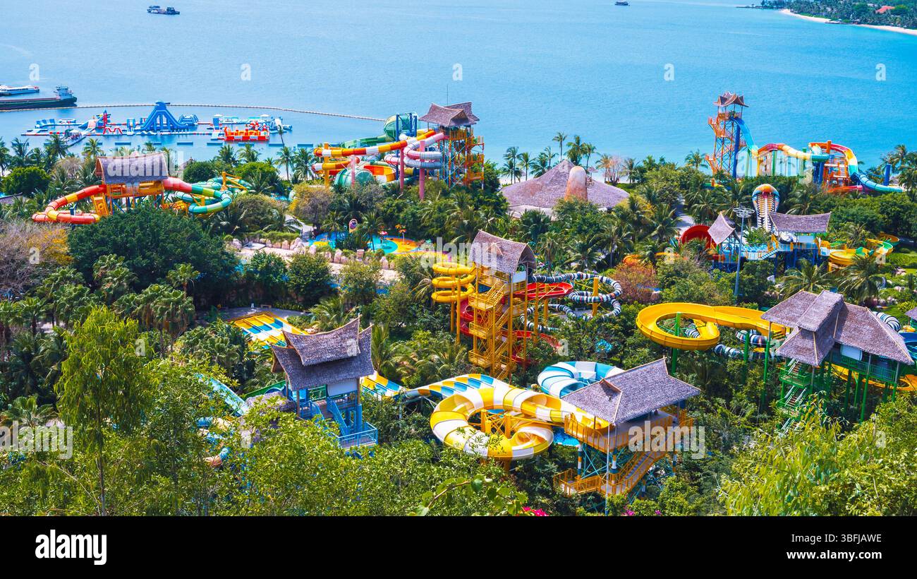 big colorful aquapark with slides and a swimming pool at resort in ...