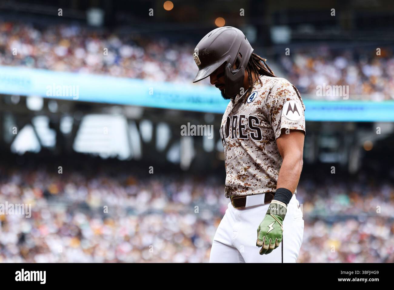San Diego Padres' Fernando Tatis Jr. walks back to the dugout after ...