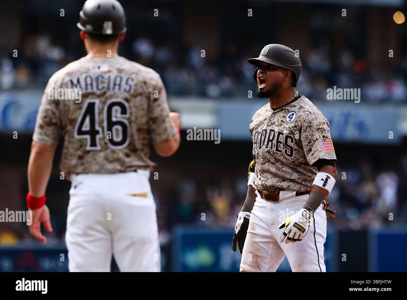 San Diego Padres' Luis Arraez, right, celebrates after hitting an rbi ...