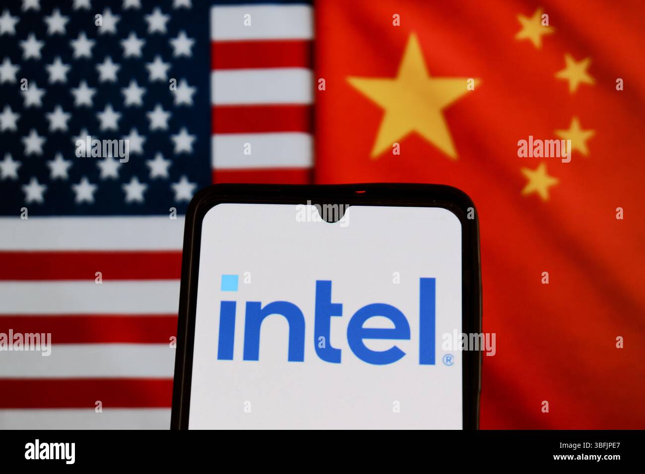 In this photo illustration, the Intel logo seen displayed on a ...