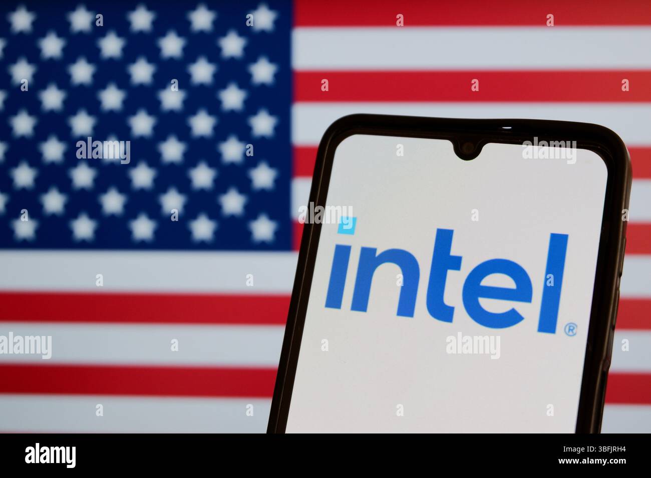 In this photo illustration, the Intel logo seen displayed on a ...
