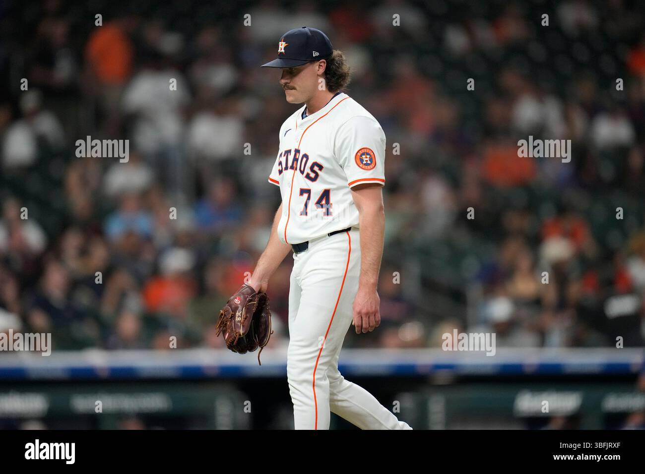 Houston Astros relief pitcher Bryan King (74) walks back to the dugout ...