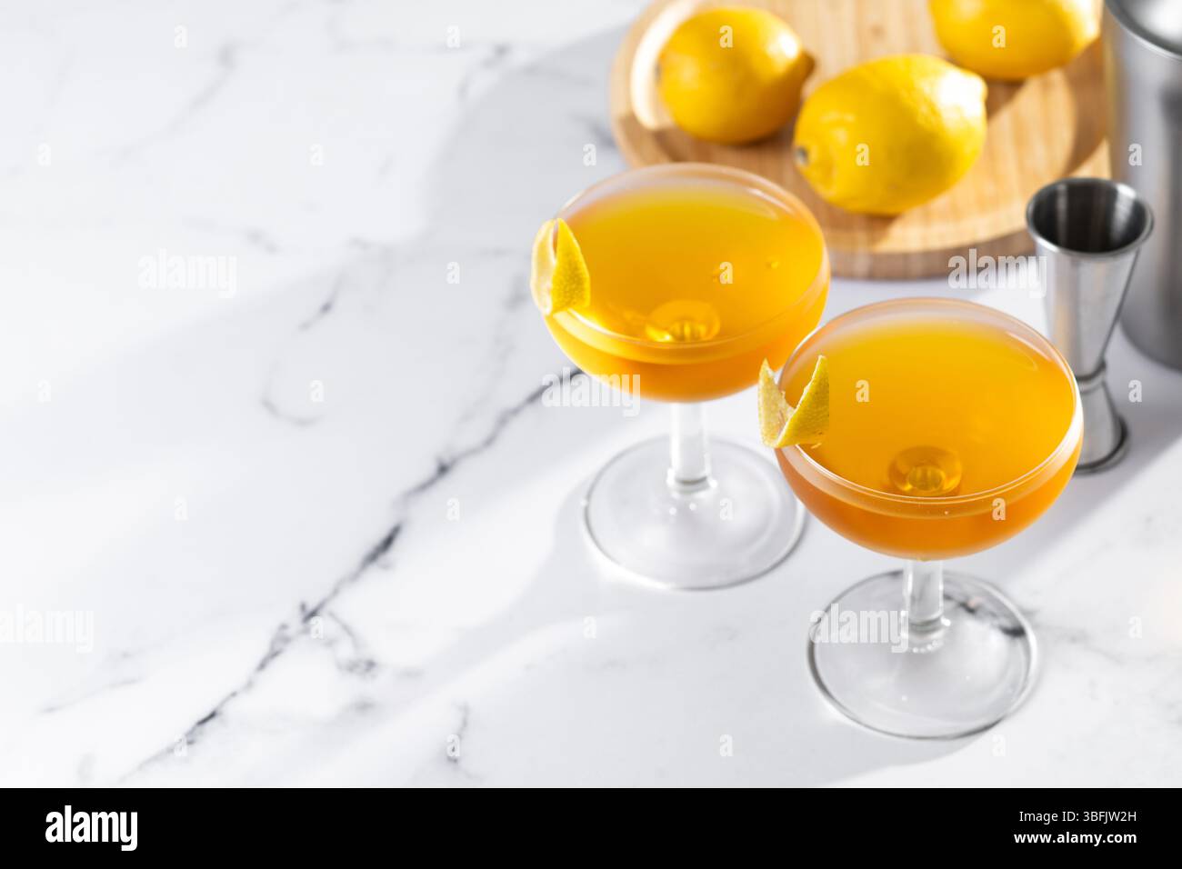 Paper plane cocktail on white marble Stock Photo - Alamy