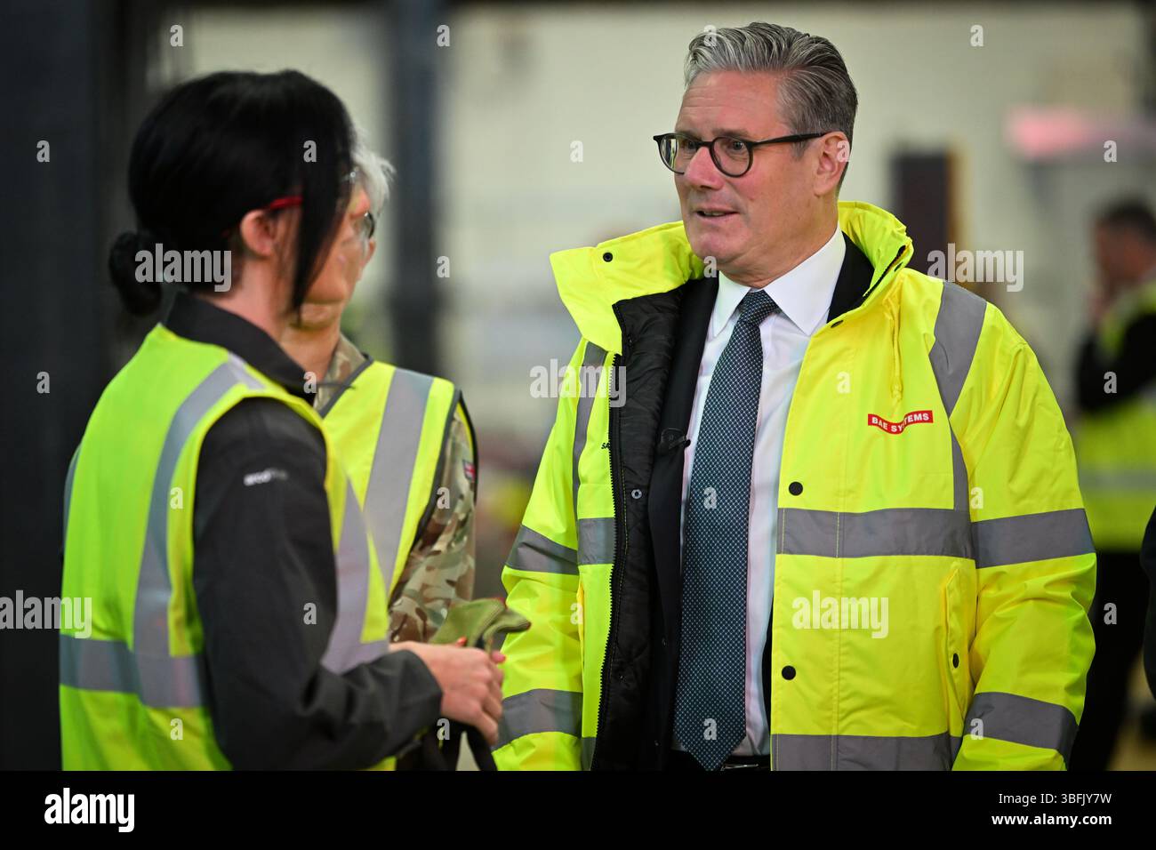 Prime Minister Sir Keir Starmer speaks to a member of staff during a ...