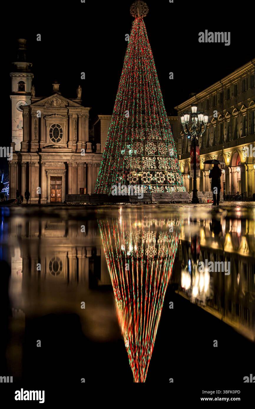 Turin christmas tree in San Carlo Square reflecting in a puddle Stock ...