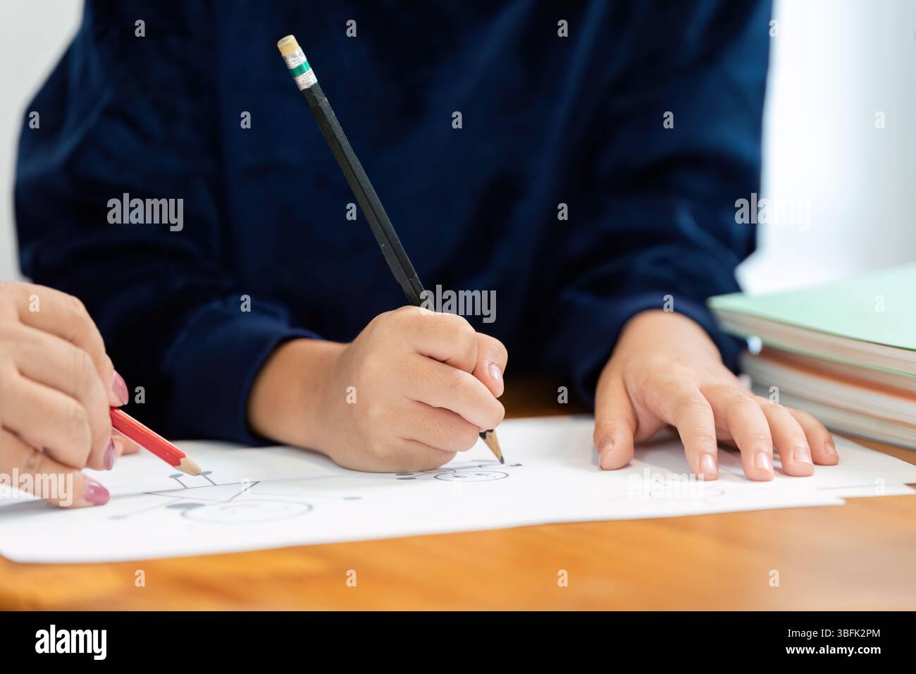 Back to School and Creative Learning. Two students engaged in drawing ...