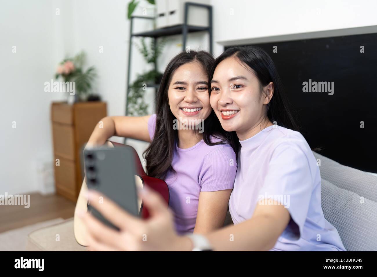 LGBTQIA Couple Smiling Together While Taking Selfie Stock Photo - Alamy