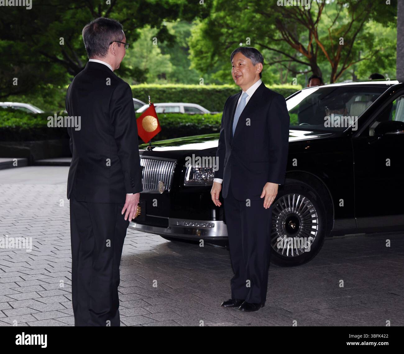 Japanese Emperor Naruhito (R) arrives at a hotel to attend a ceremony ...