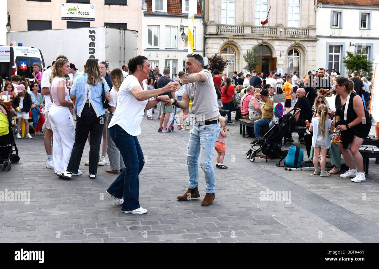 Couples dancing in the street during May Day La Fête du Muguet (Lilly ...