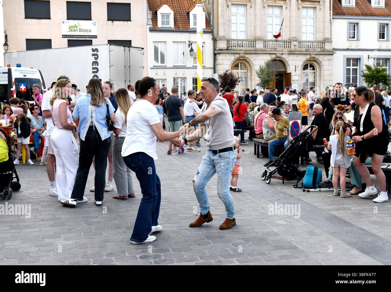 Couples dancing in the street during May Day La Fête du Muguet (Lilly ...
