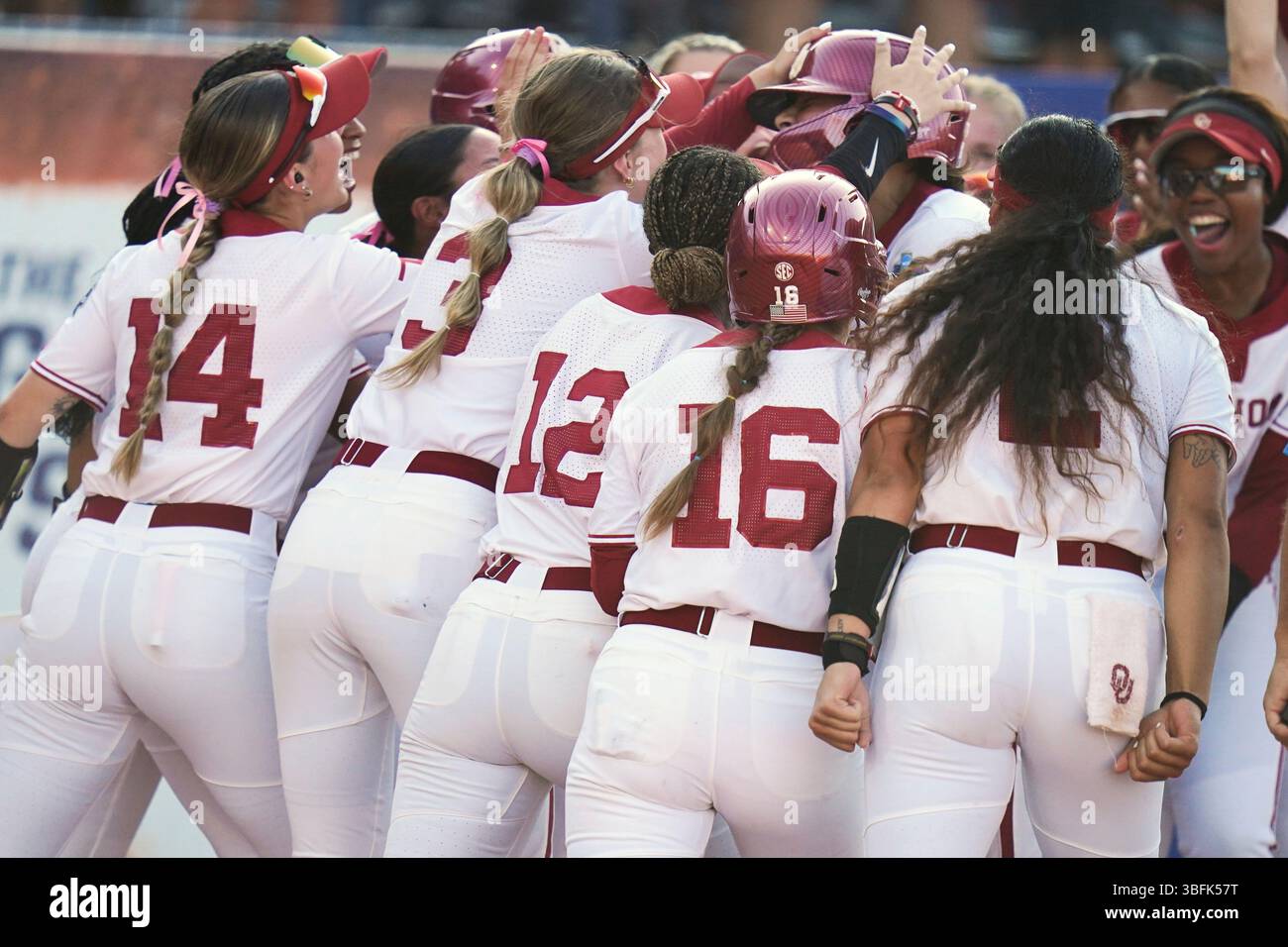 Oklahoma catcher Isabela Emerling (13) gets mobbed by teammates after ...