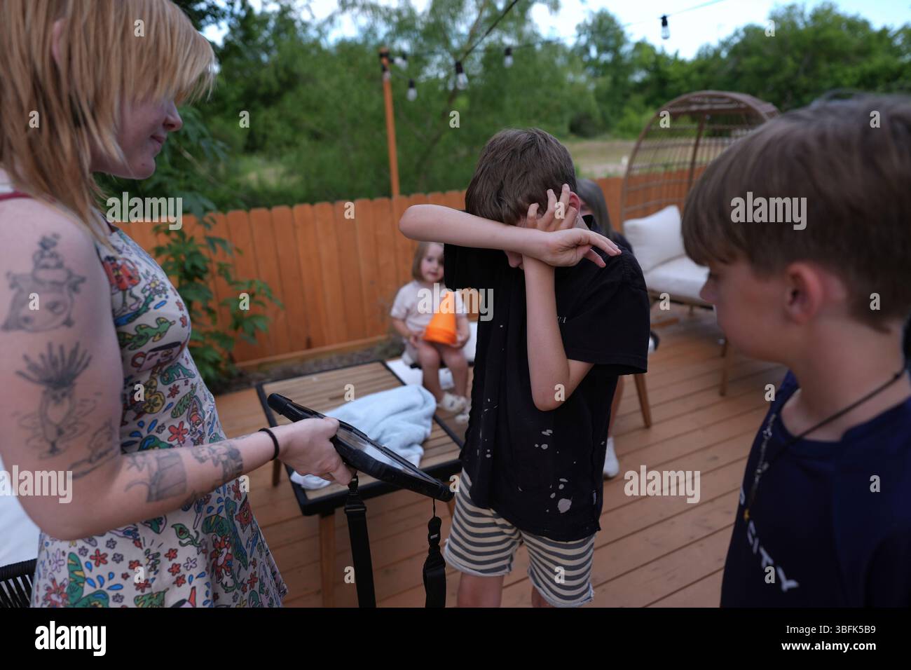 Charlie Lamb, center, who is diagnosed with autism and is non-verbal ...