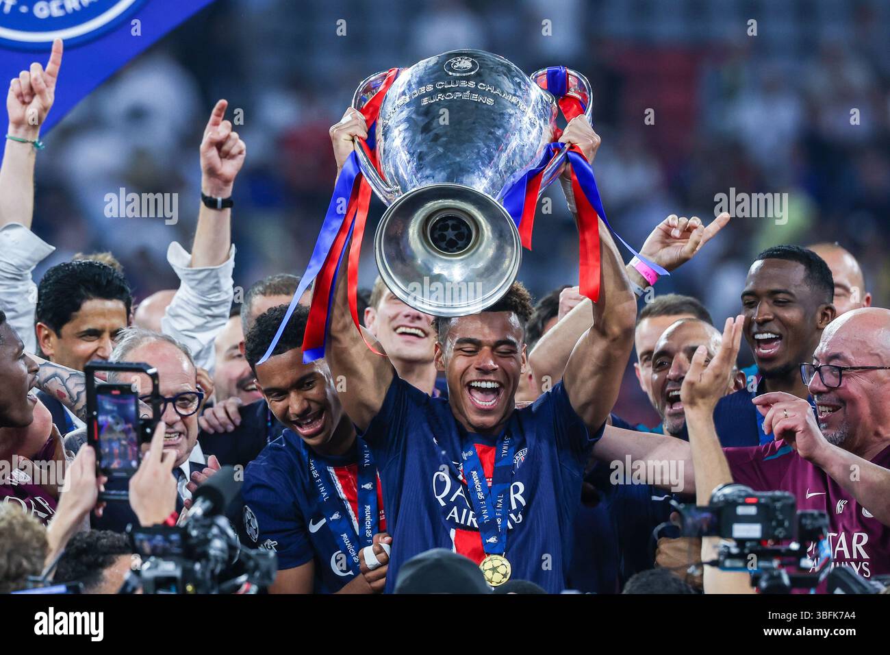 Desire Doue of Paris Saint-Germain FC lifts the trophy and celebrate ...