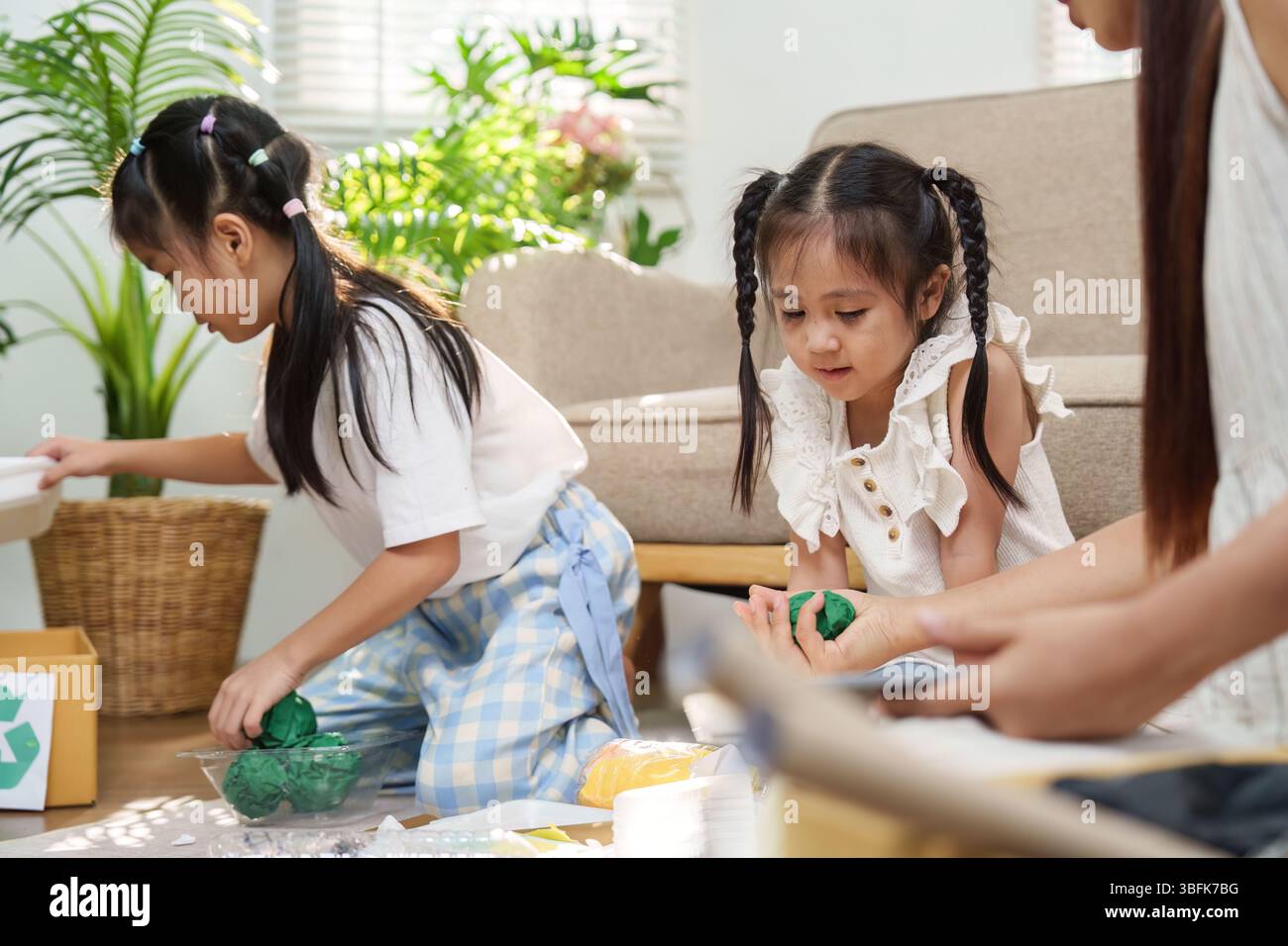 Family and Sustainability. Children engaging in eco-friendly activities ...