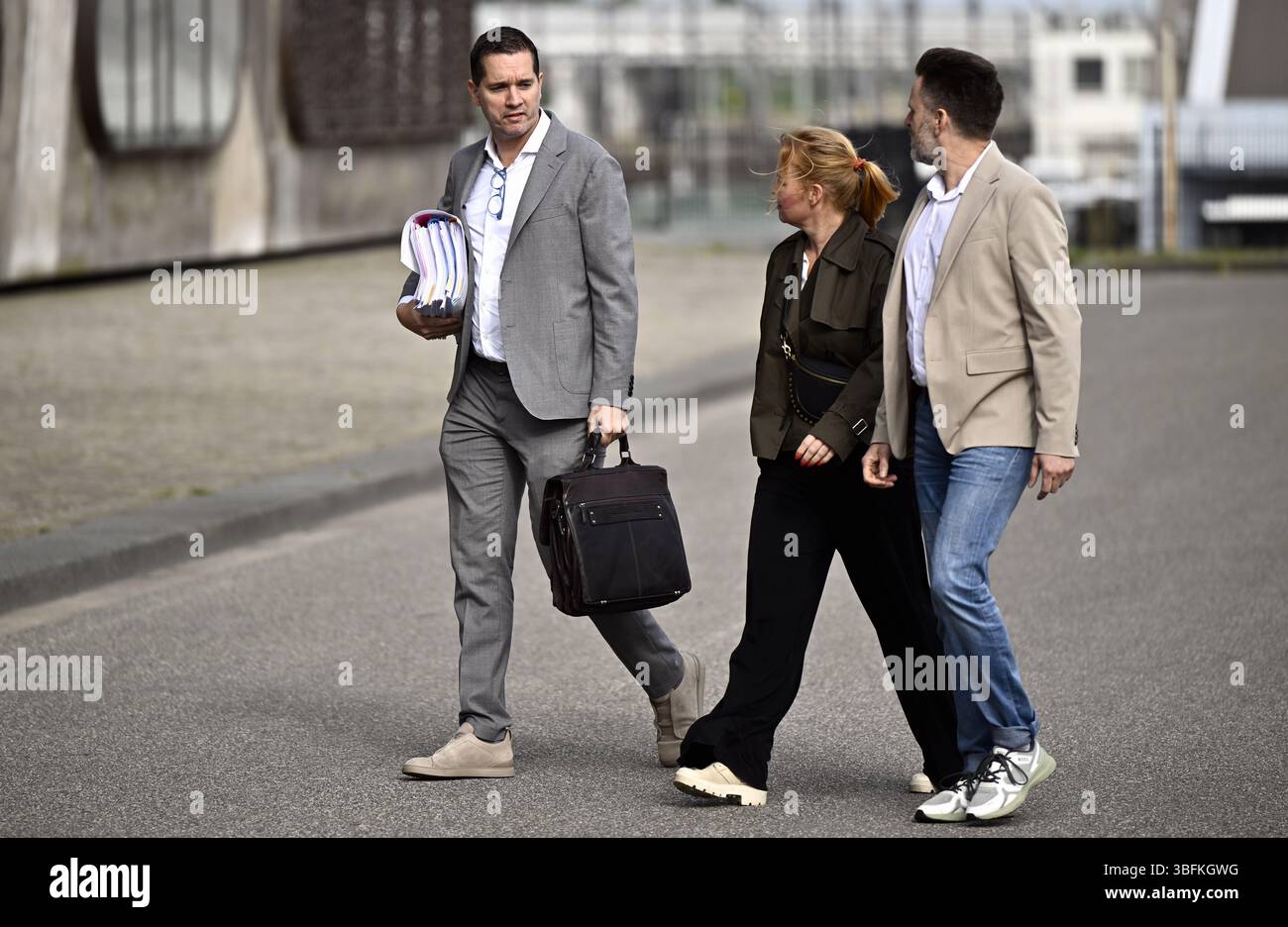 Lawyer Michiel Van Kelecom (L) and Chantal Veldboer (C) arrive for the ...
