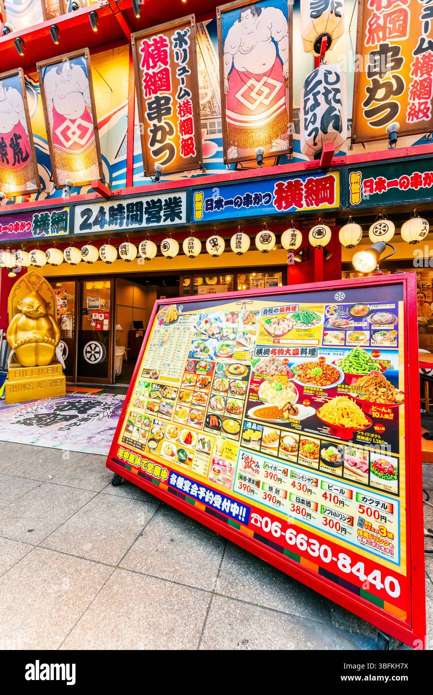 Menu board and Billiken statue leading to the entrance to the Yokozuna ...