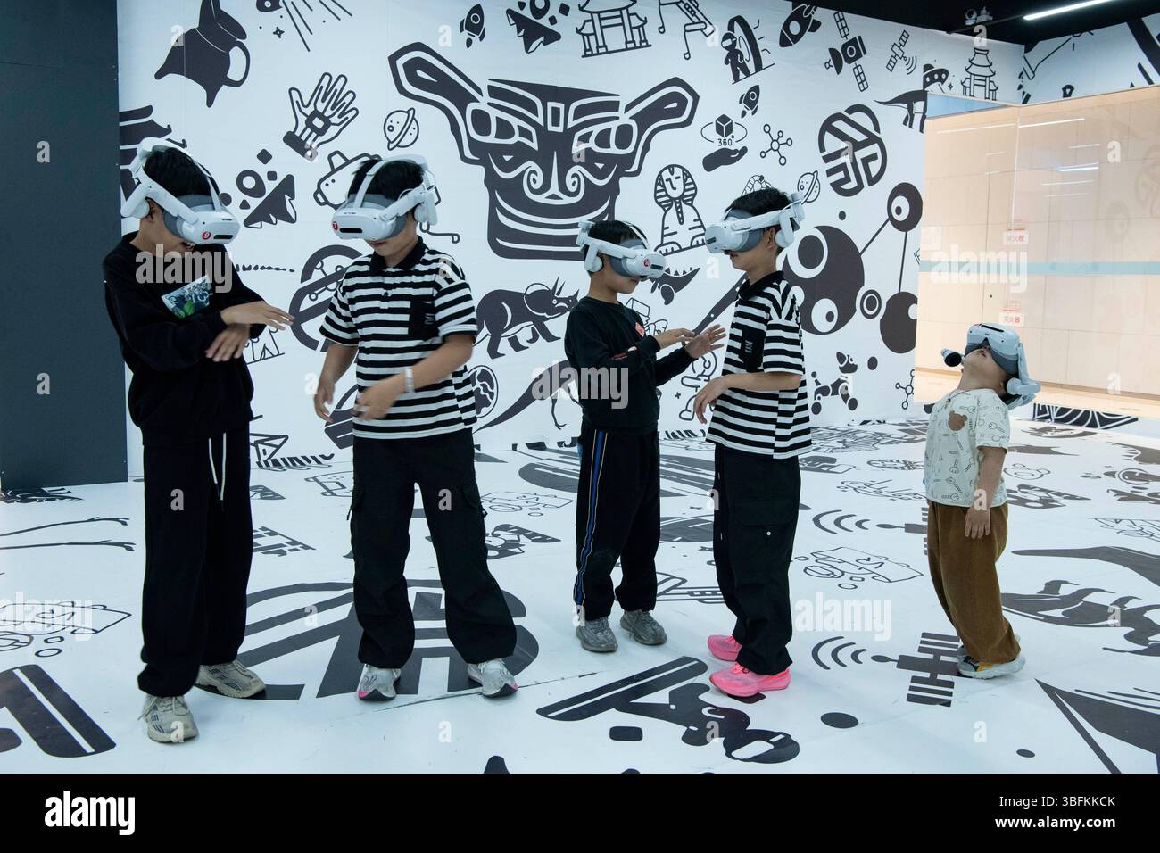 HAIAN, CHINA - JUNE 2, 2025 - Children are experiencing in a VR ...