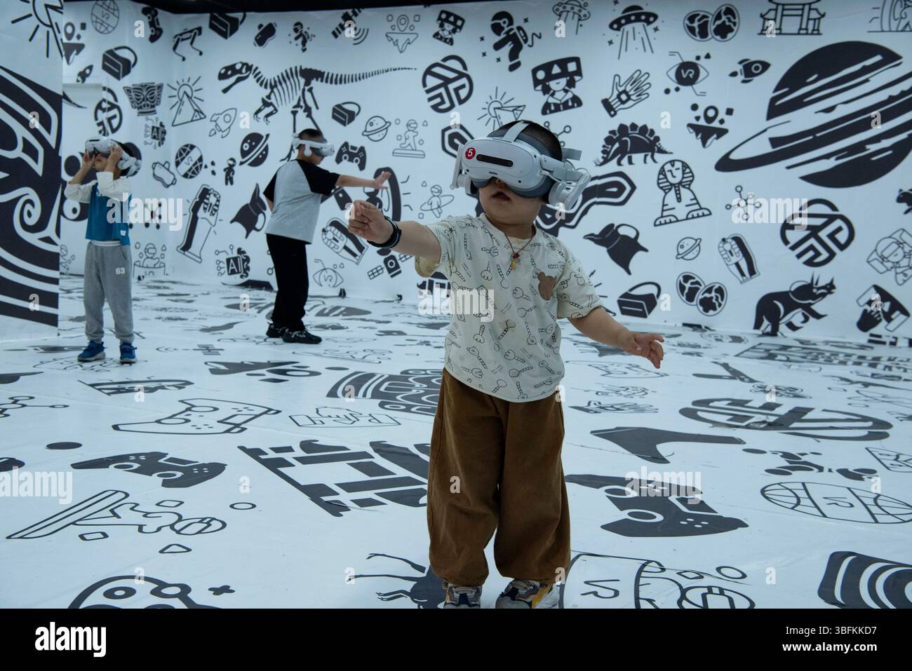 HAIAN, CHINA - JUNE 2, 2025 - Children are experiencing in a VR ...